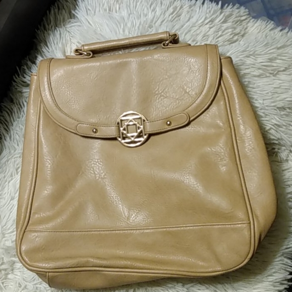 Cato | Bags | Catos Backpackpurse Golden W Purple Inside | Poshmark